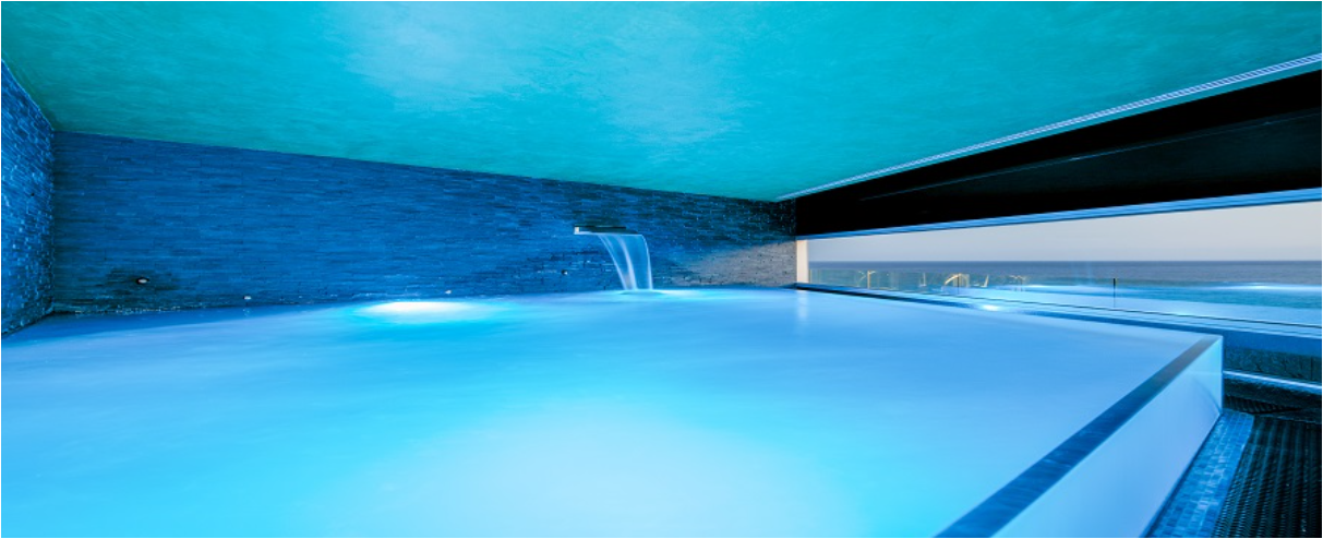 Underwater window with water overflow on sunny Mallorca.
